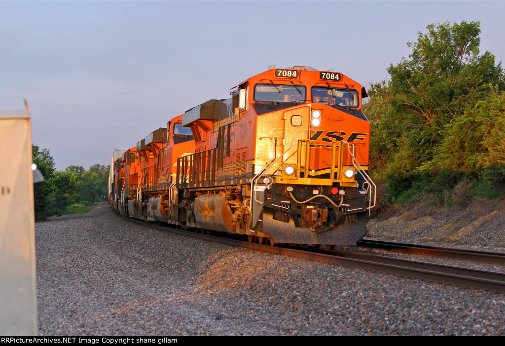 BNSF 7084 Leads a EB z train into the Morning Sun!!